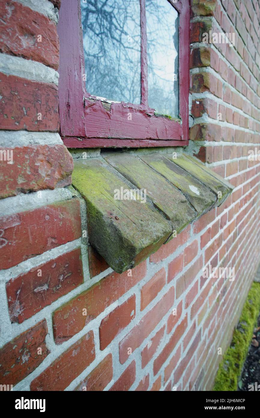 Old dirty window on a brick wall house or home. Ancient casement with ...