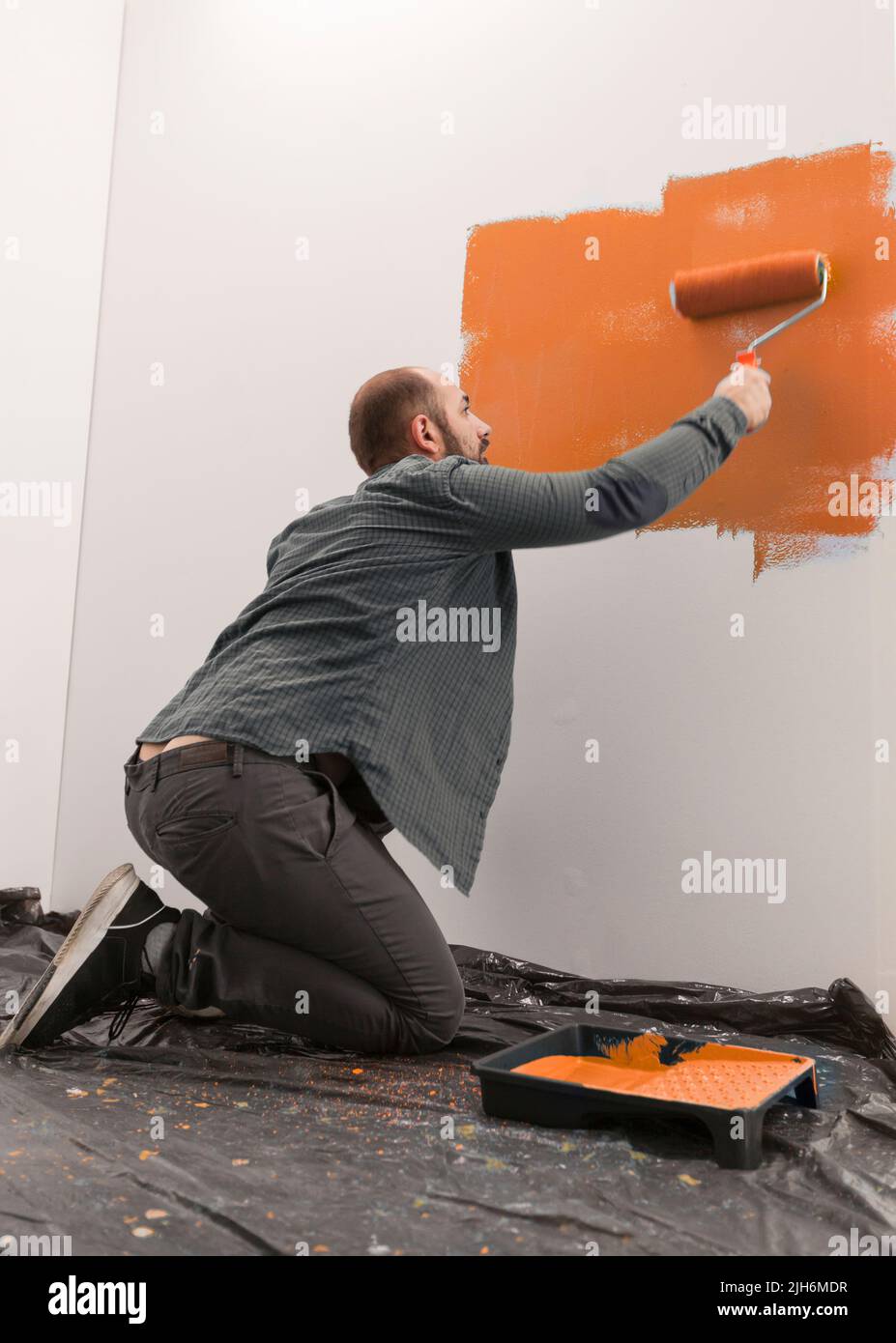 Young man contractor doing renovation hi-res stock photography and ...