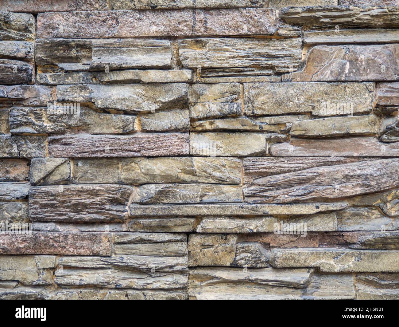Stone tiles. House facade cladding design. Masonry. brown wall Stock ...