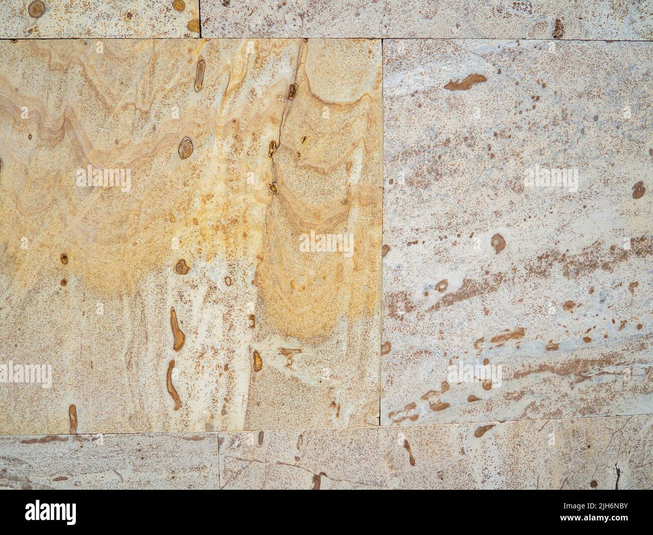 Yellow-brown material. Church cladding. Background from stone tiles ...