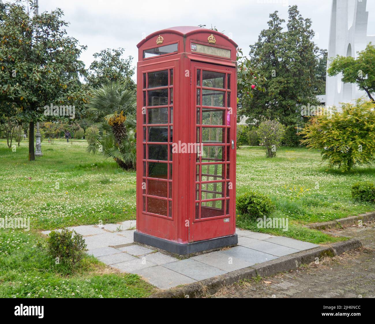Red telephone box. Fake phone. Scenery in the city park. entertainment ...