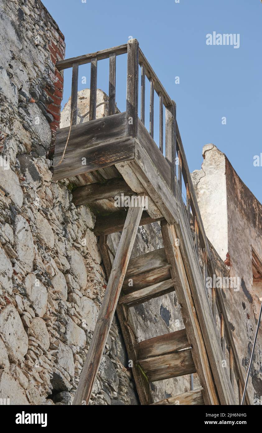 Old wooden stairs leading up to a rooftop of a historic building ...