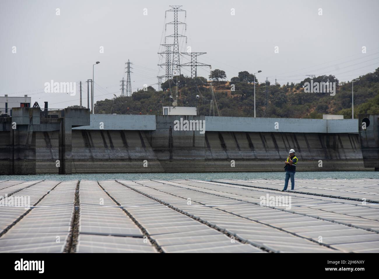 A staff member seen at the floating solar power plant in Alqueva ...
