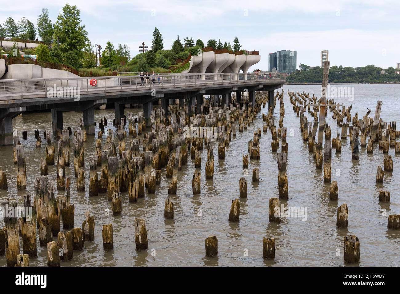 Wooden pier posts leading into Little Island off of Manhattan Stock ...