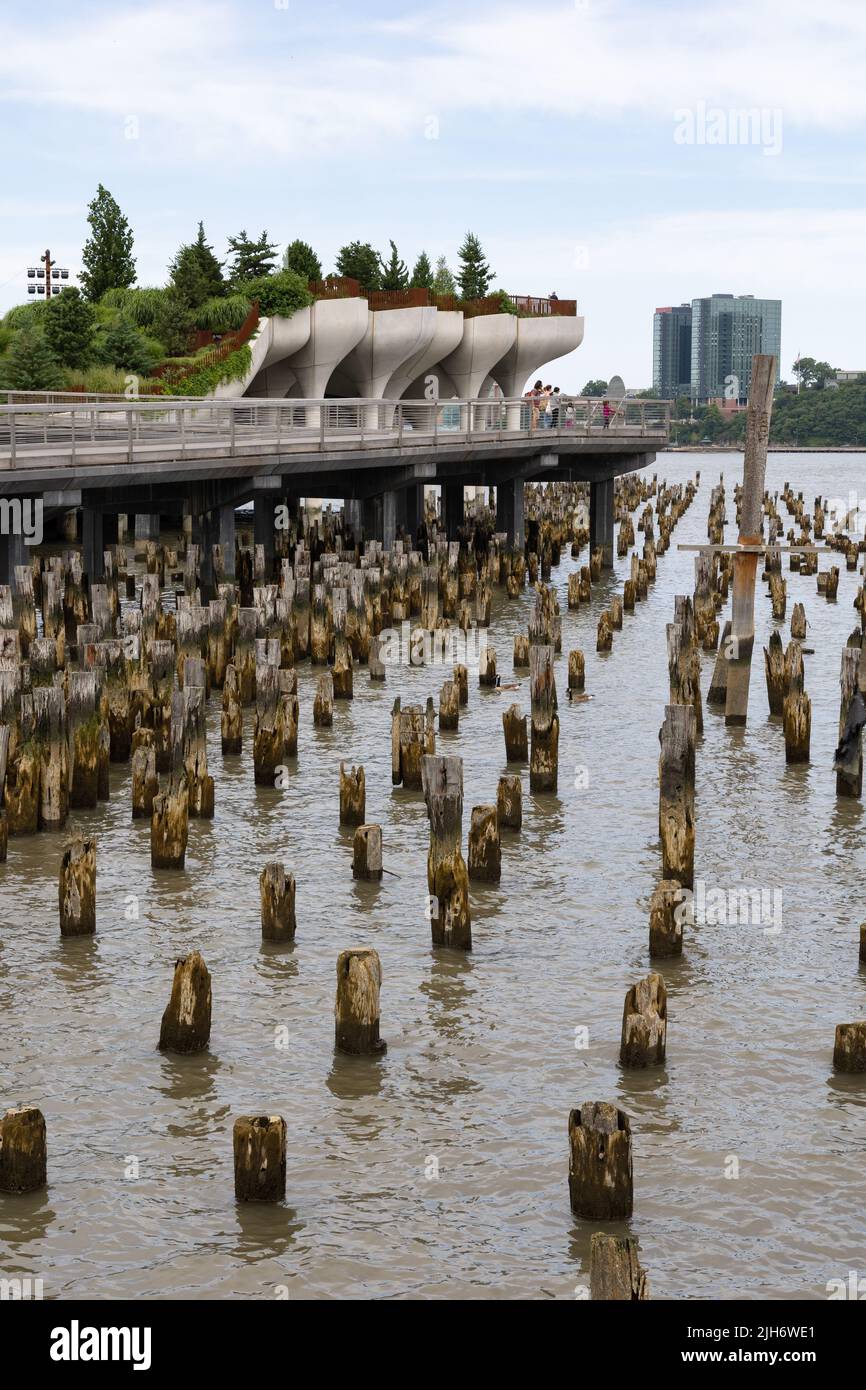 Wooden pier posts leading into Little Island off of Manhattan Stock ...