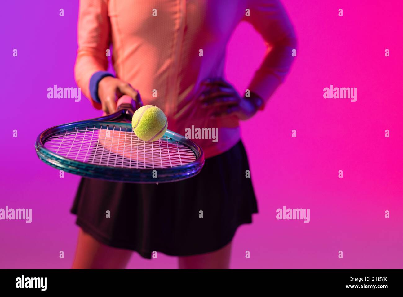 Image of midsection of african american female tennis player with ...