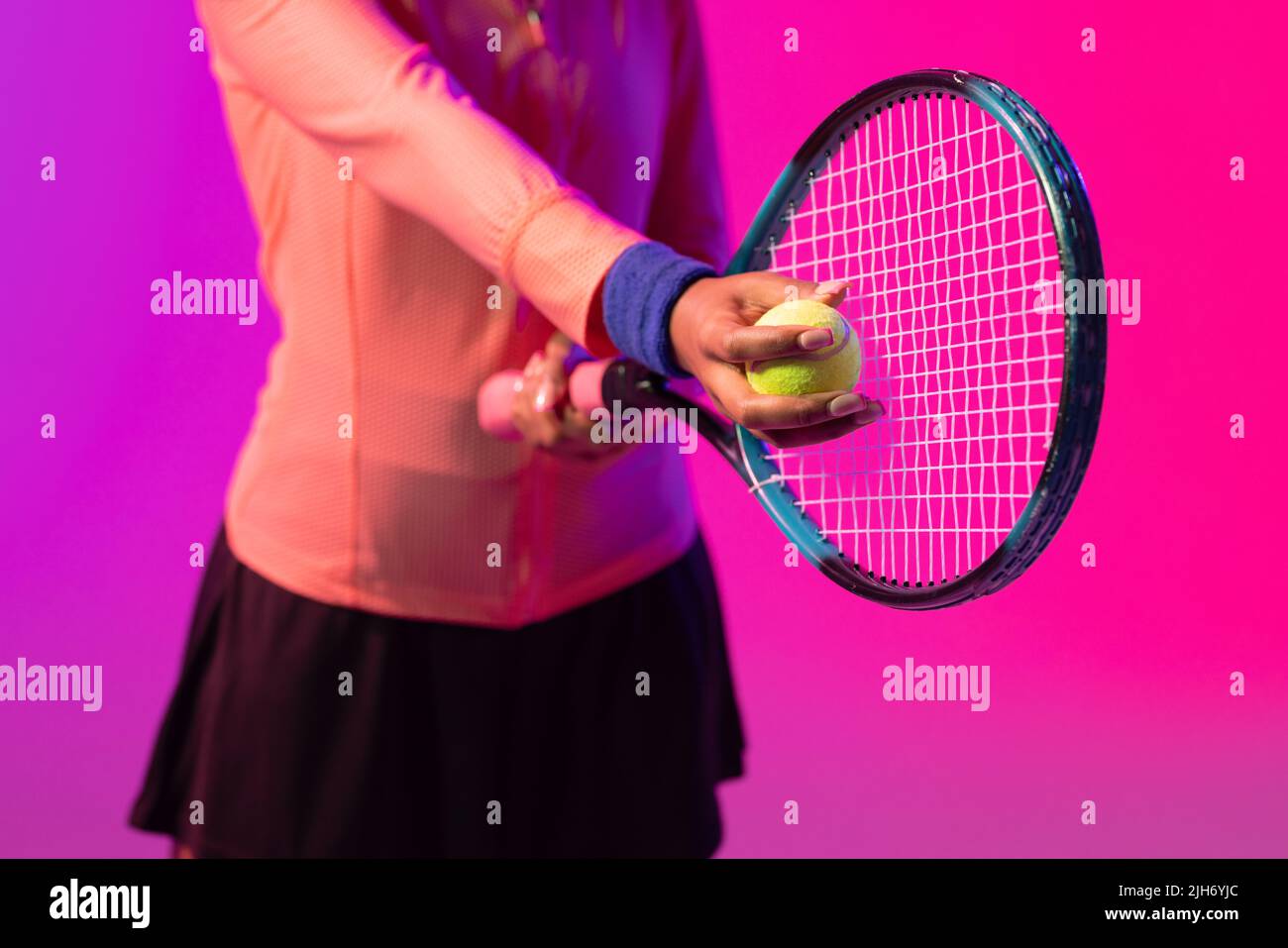 Image of midsection of african american female tennis player with ...