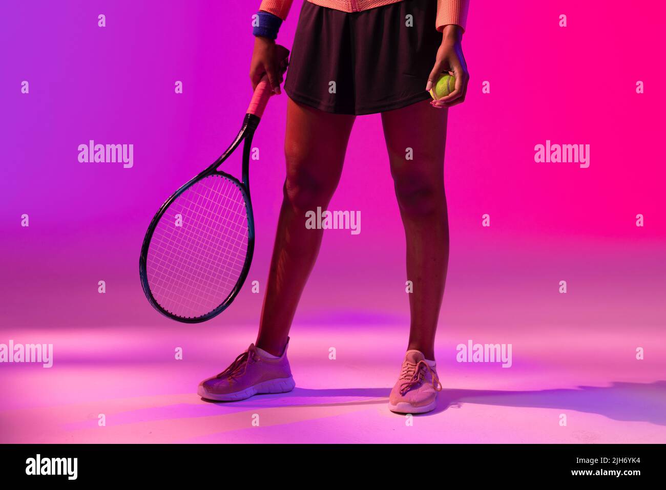 Image of low section of african american female tennis player with ...