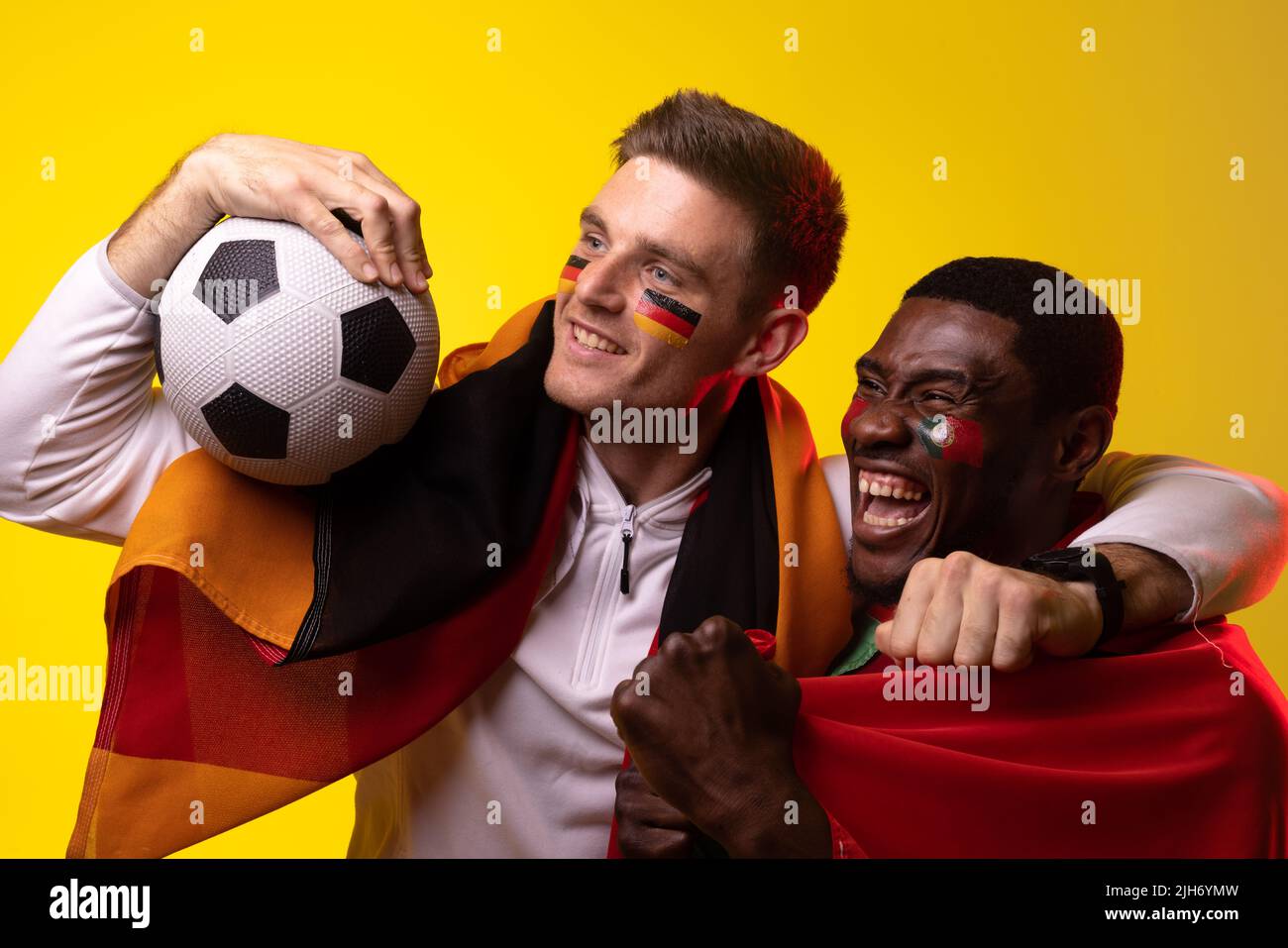 Happy diverse male football supporters hi-res stock photography and ...