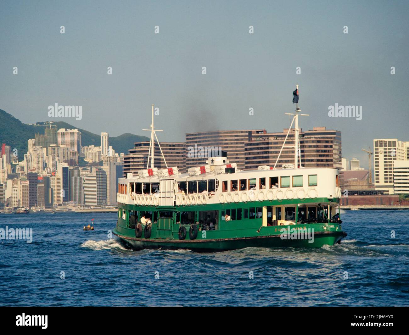 Horizontal photograph of a Star Ferry in front of New World Centre ...
