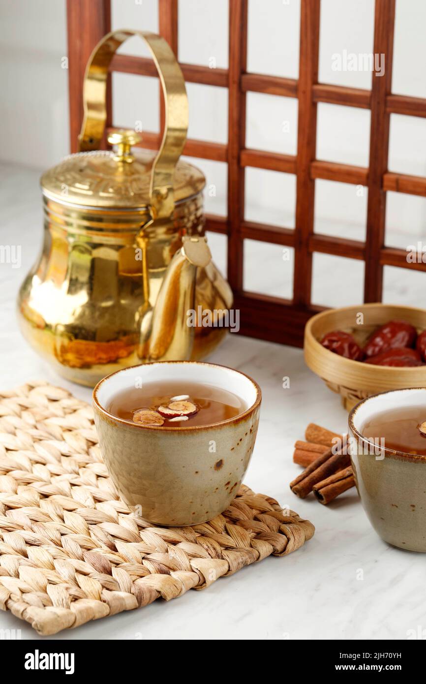 Close Up of Sujeonggwa Persimmon Punch with Ice and Dried Persimmons in ...