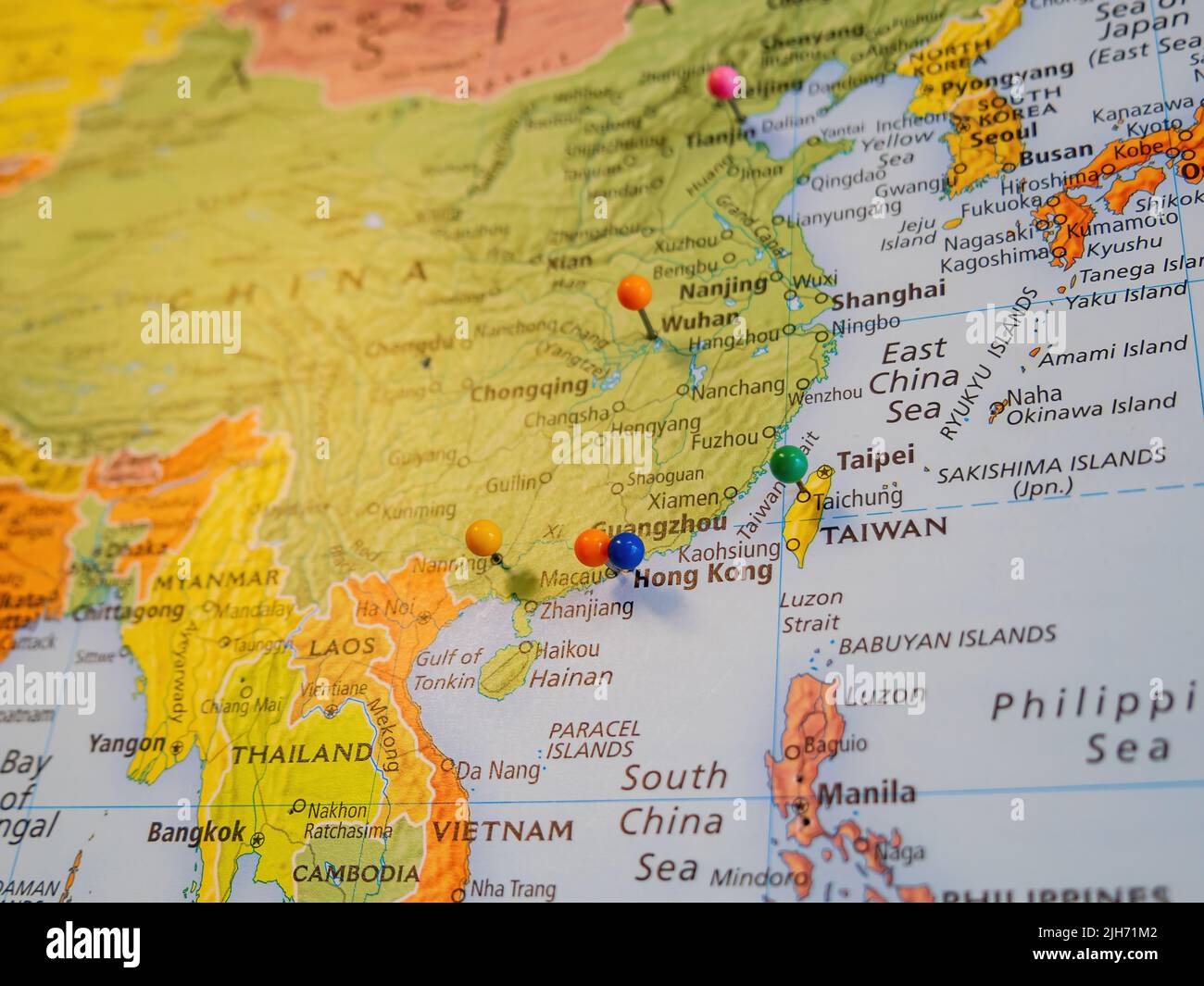 Close up shot of an international map focus on Asia with some pins at ...