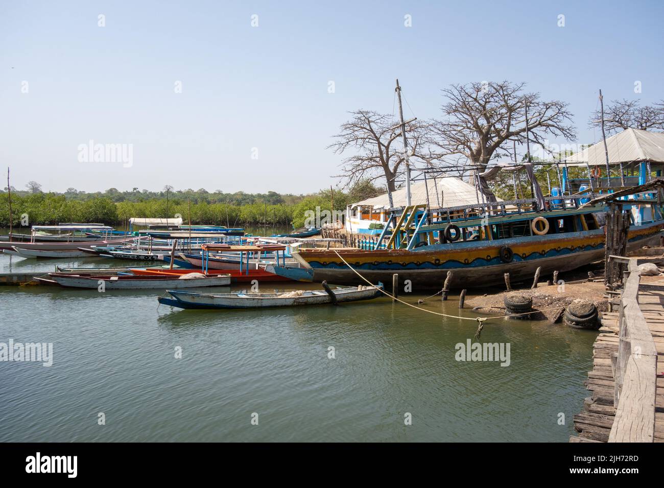 LAMIN, THE GAMBIA - FEBRUARY 6, 2022 local boats at anchor Stock Photo ...
