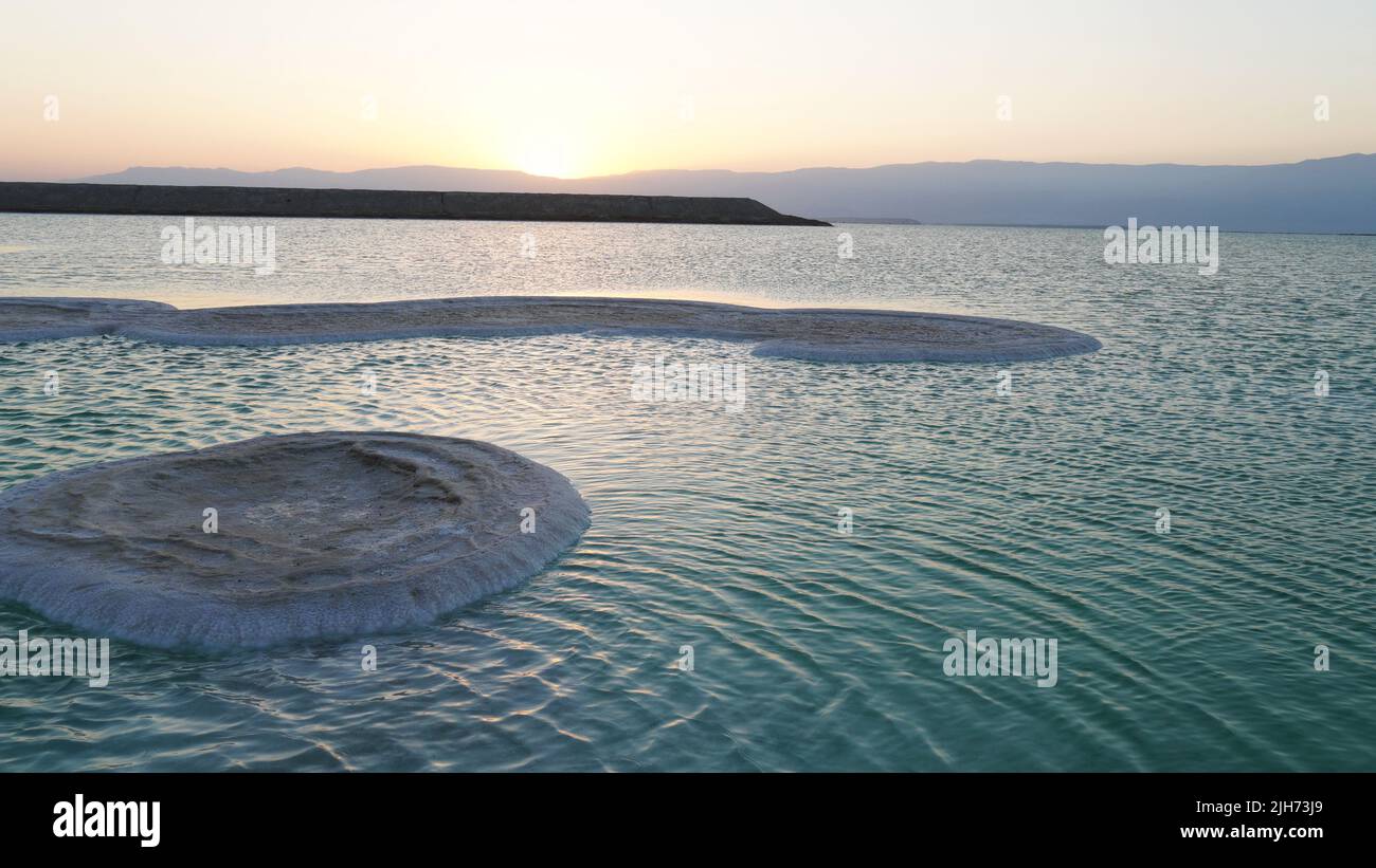 Large Salt accumulated on the shore of the Dead sea. Deposits of mineral salts, typical ...