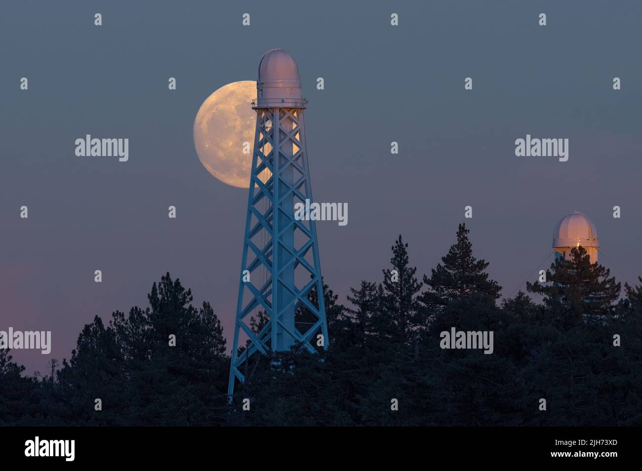 Full moon rising behind the 150 ft Solar Tower Telescope at Mt Wilson ...
