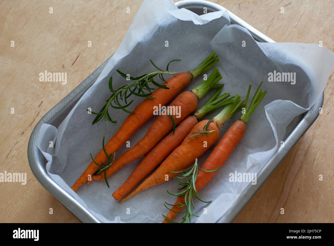 Carrot with greens hi-res stock photography and images - Alamy