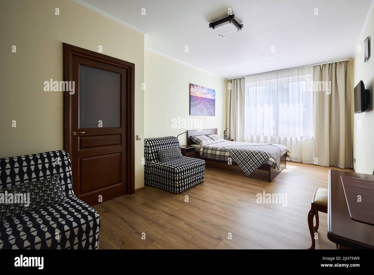 Cozy room with decor for daily rent Stock Photo - Alamy