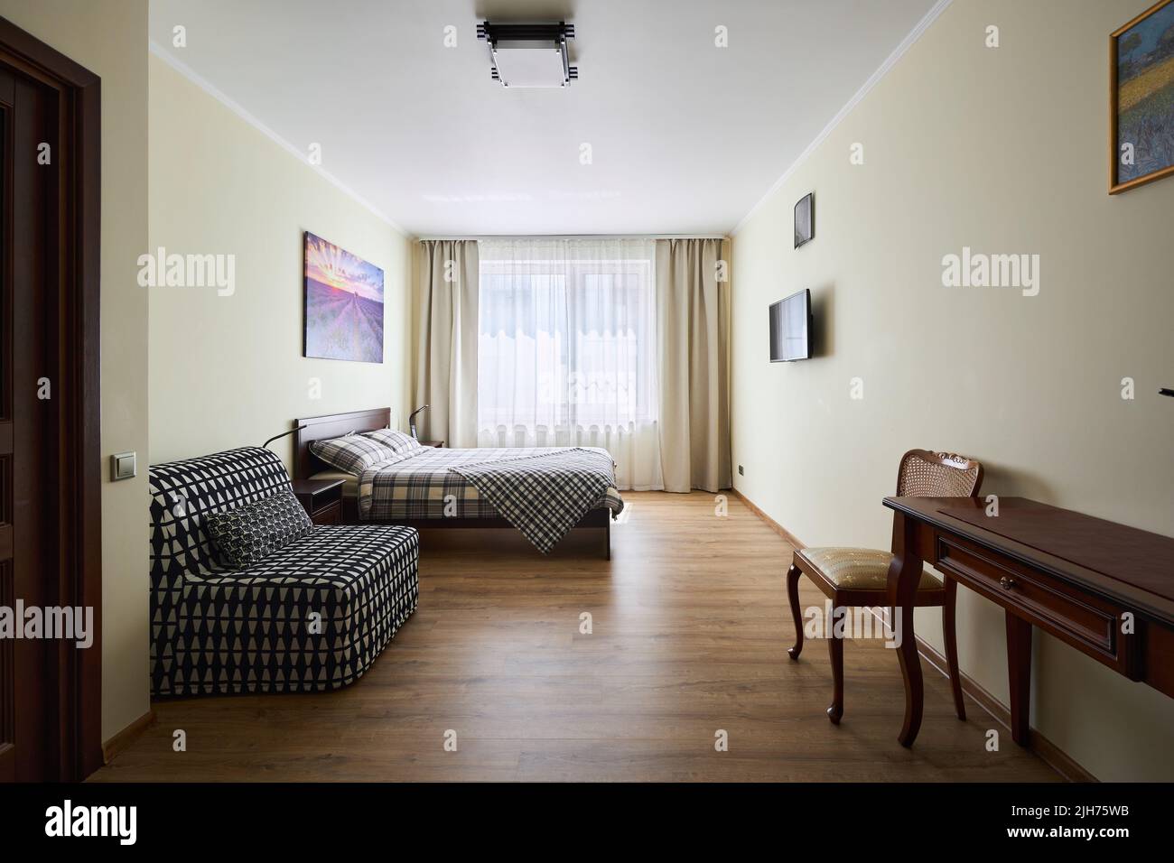 Cozy room with decor for daily rent Stock Photo - Alamy