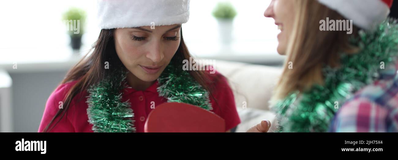 Female in santa claus hat open empty box, no present, practical joke ...