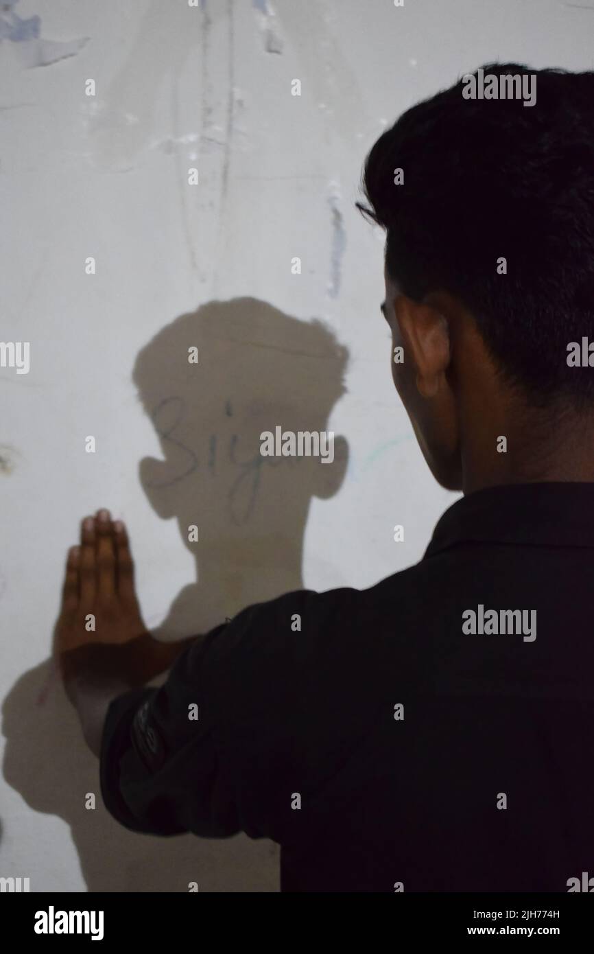 A man and his shadow . Concept -loneliness and depression Stock Photo ...