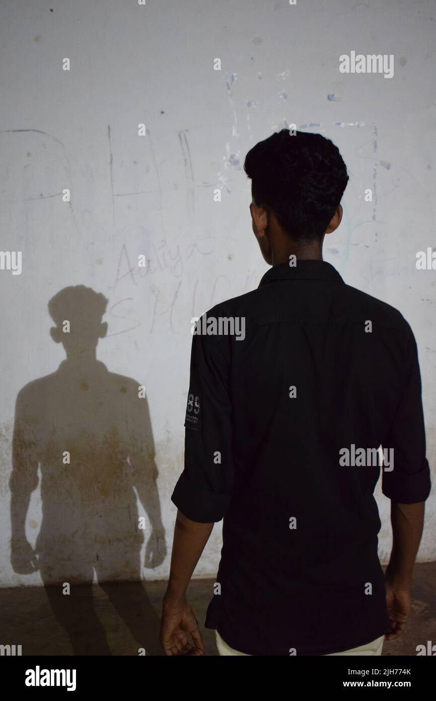 A man and his shadow . Concept -loneliness and depression Stock Photo ...