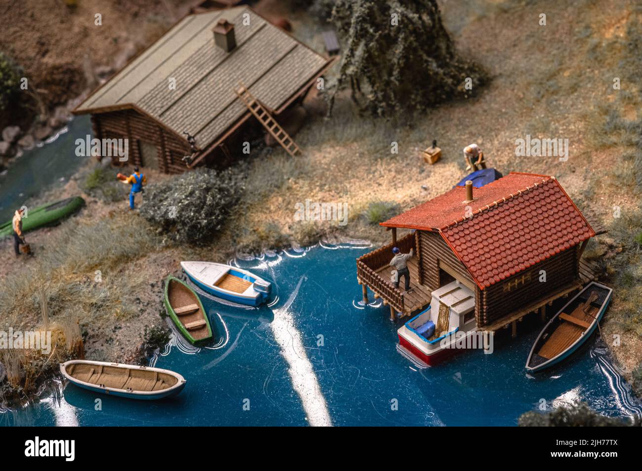 Toy representation of a small town lifestyle. Boats on the shore Stock ...