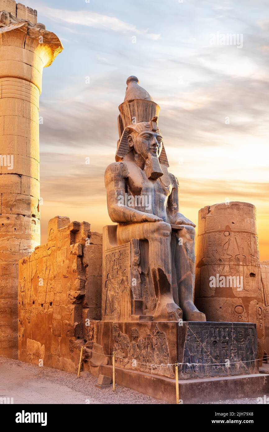 Seated statue of Ramesses II by the Luxor Temple entrance, sunset ...