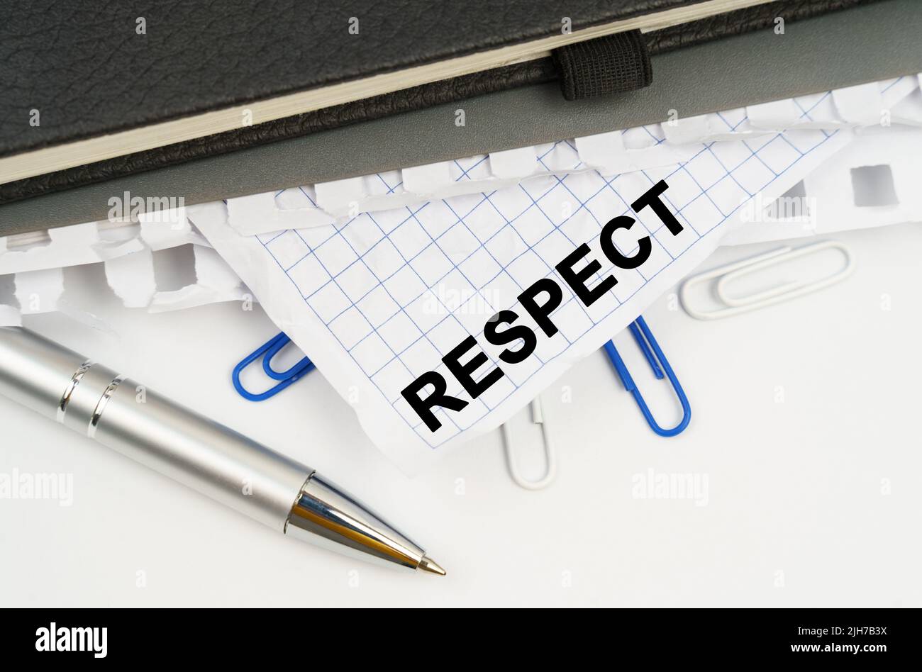 Business concept. On the table is a pen, notebooks and a crumpled sheet ...