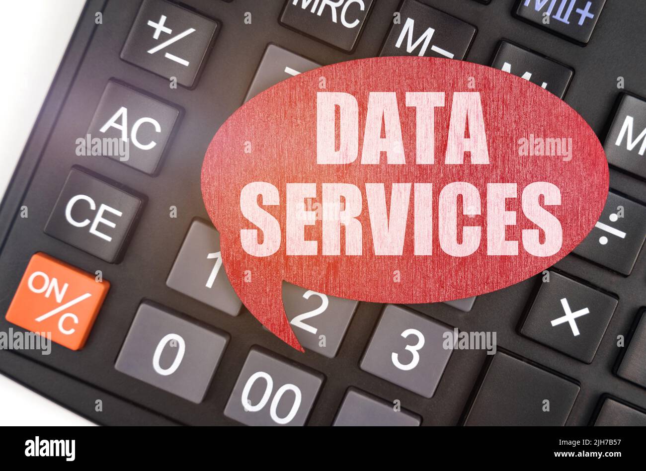 Business and finance concept. There is a red plaque on the calculator ...