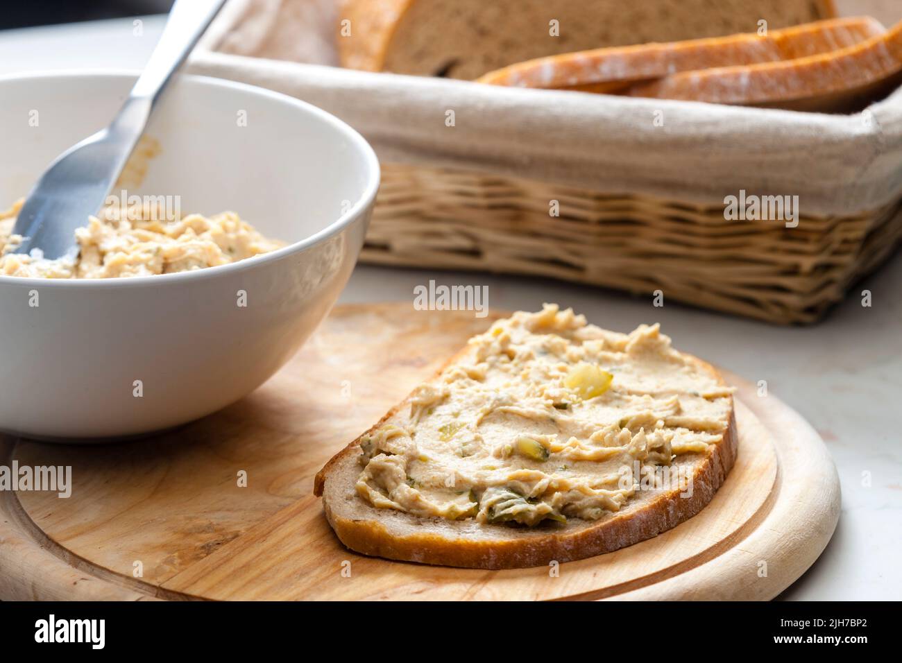 cracklings spread with pickled cucumber on slice of bread Stock Photo ...