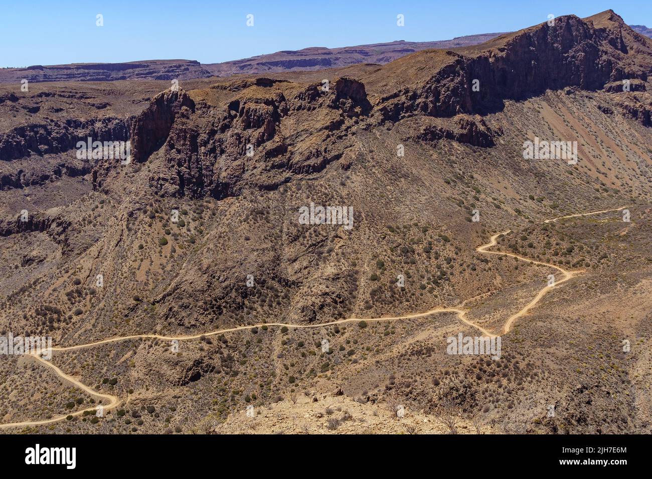 aerial view of the mountains of Gran Canaria with a road that goes ...