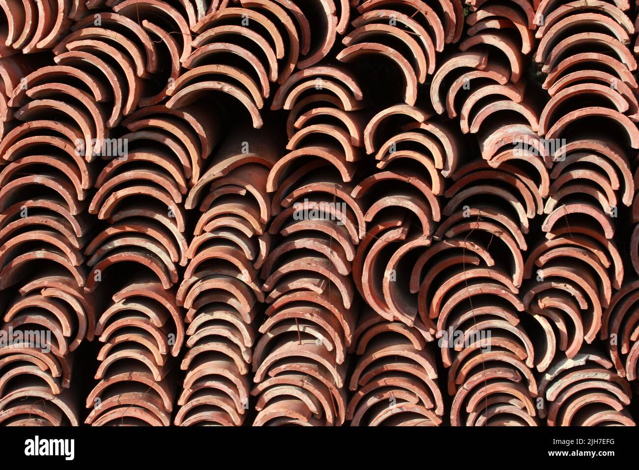 Old clay ceramic roofing tile stacked Stock Photo - Alamy