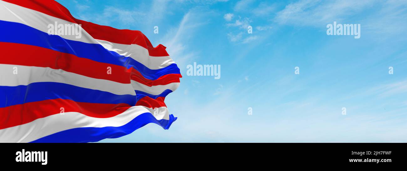 official flag of Old Bali Indonesia at cloudy sky background on sunset ...