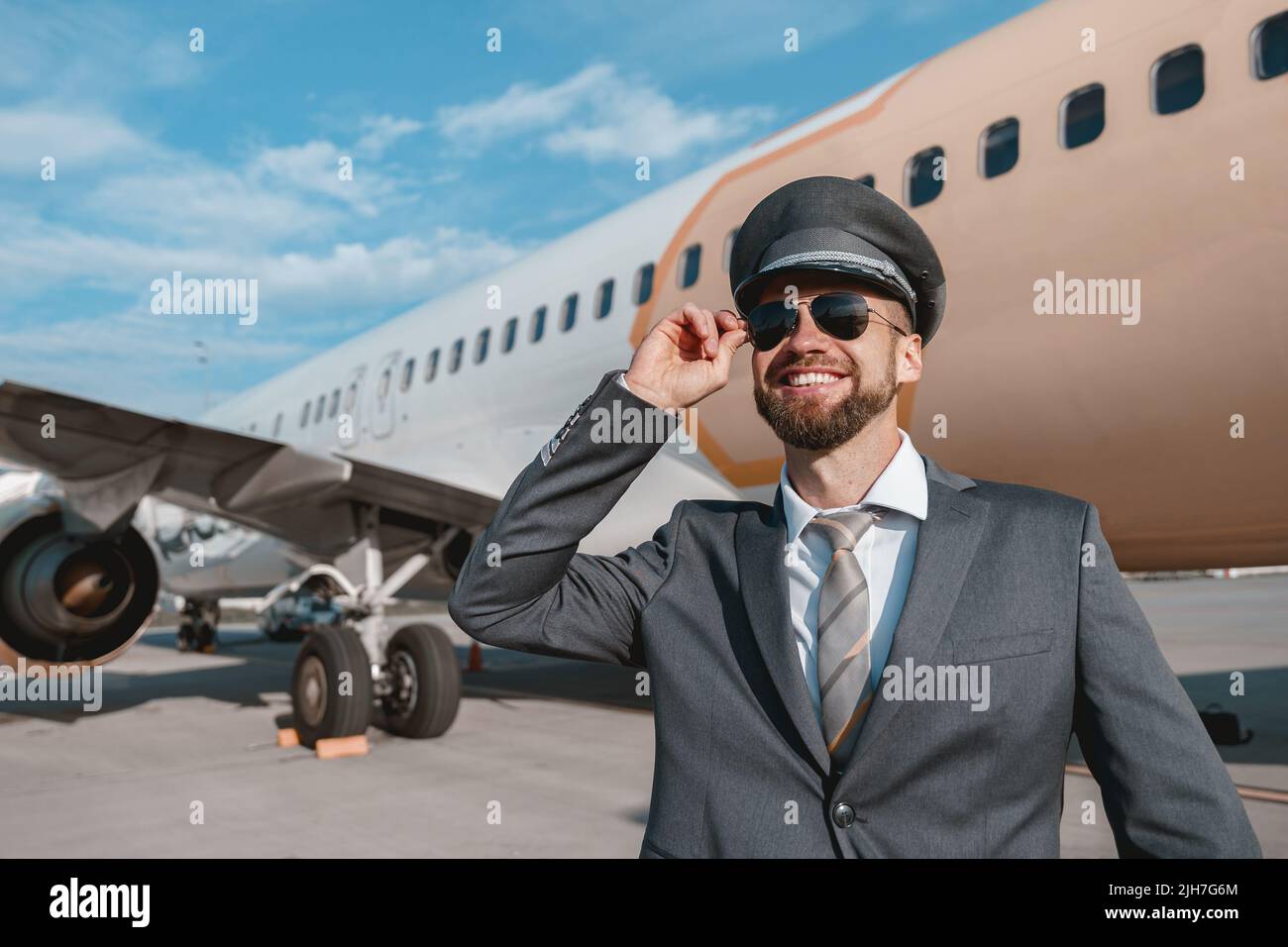 Joyful aircraft pilot standing outdoors at airfield Stock Photo - Alamy
