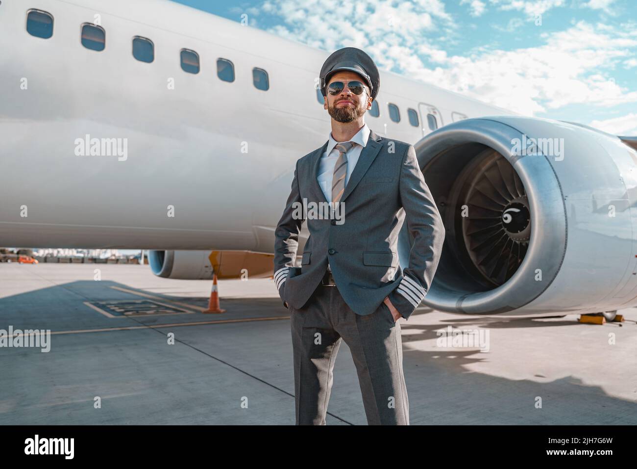 Joyful aircraft pilot standing outdoors at airfield Stock Photo - Alamy