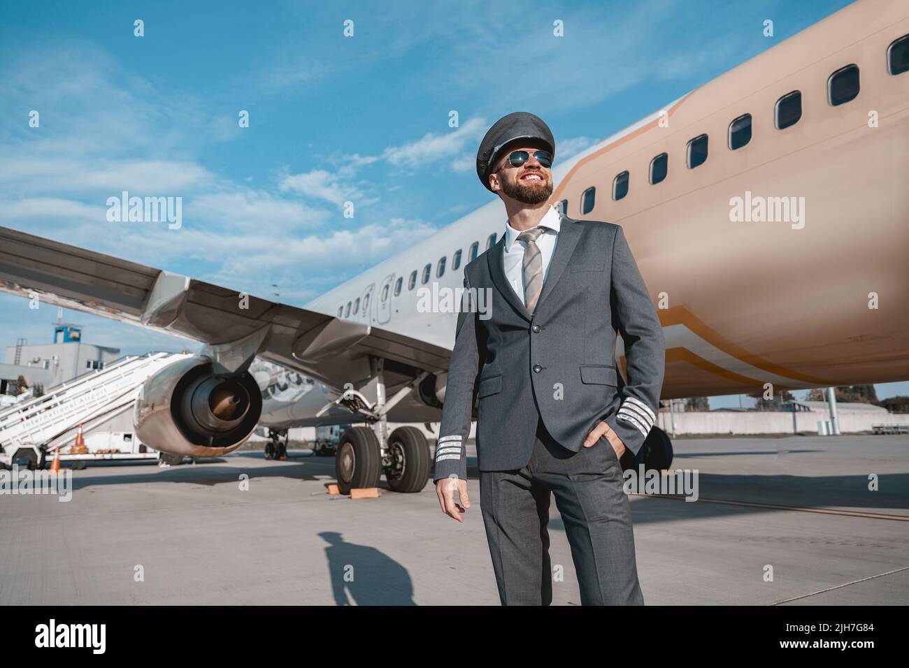Joyful aircraft pilot standing outdoors at airfield Stock Photo - Alamy