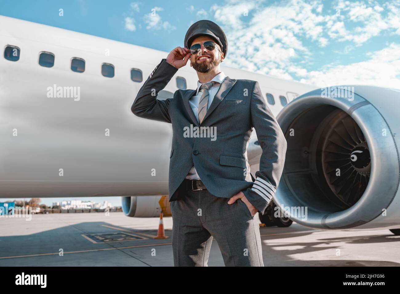 Joyful aircraft pilot standing outdoors at airfield Stock Photo - Alamy