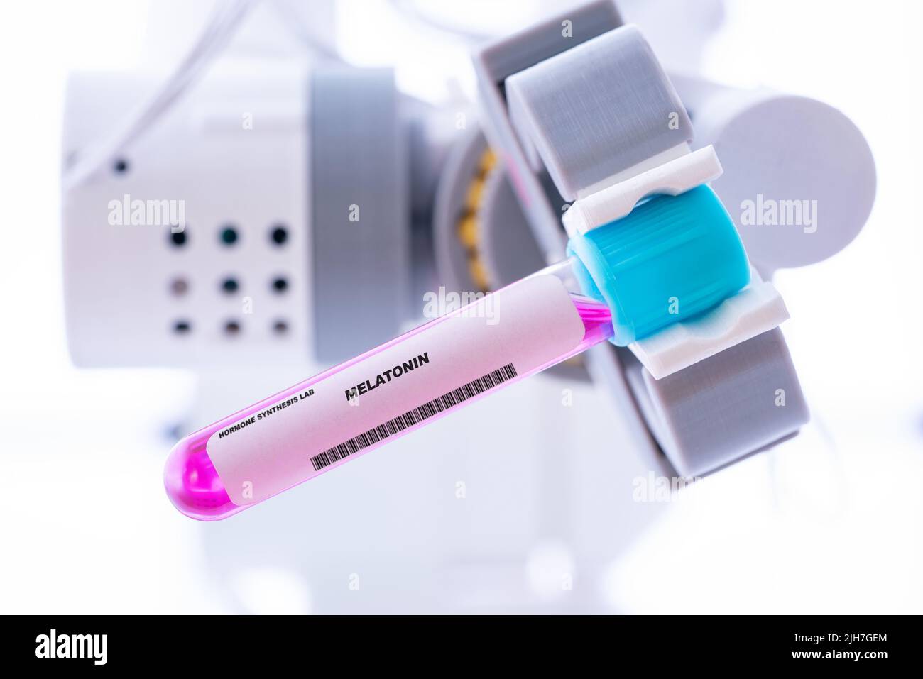 Melatonin. Test tube with artificial hormone in robot hand Melatonin ...