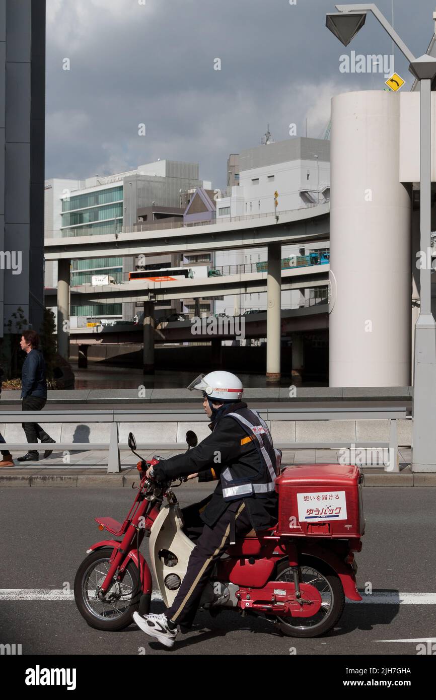 A Japanese postman on a moped. Nihonbashi, Tokyo, Japan Stock Photo - Alamy