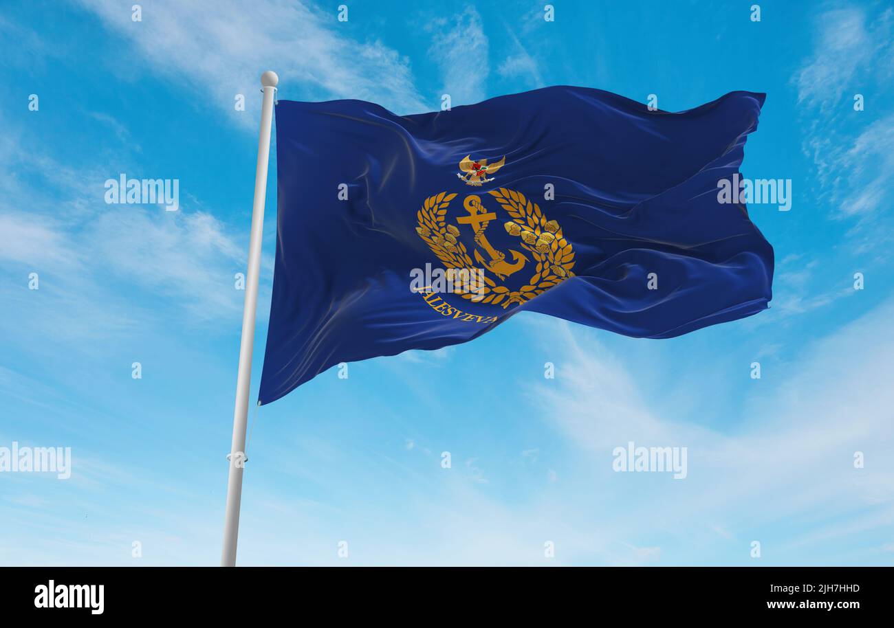 official flag of Navy Indonesia at cloudy sky background on sunset ...