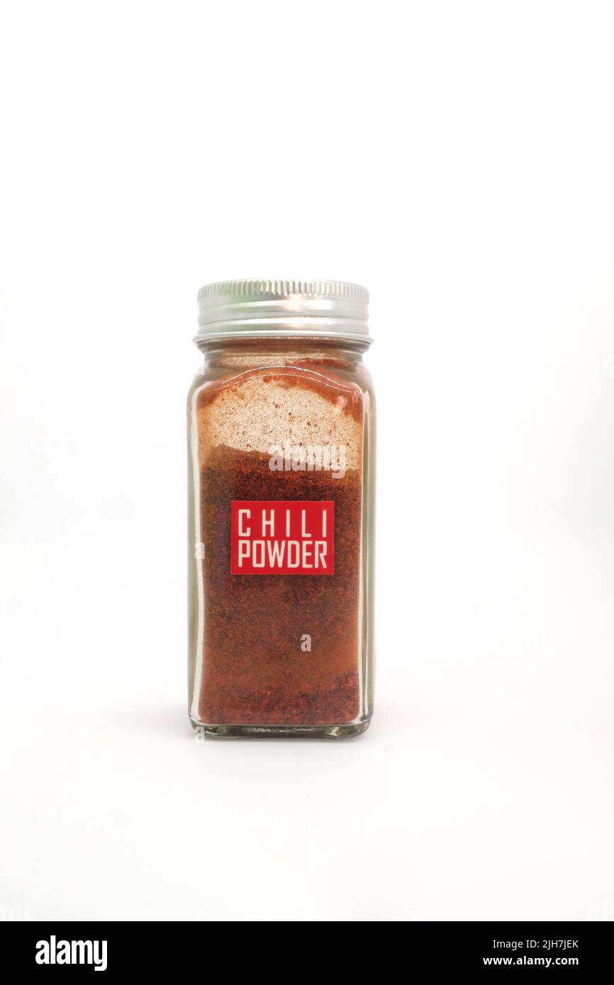 Chili powder in spice condiment glass bottle with label isolated in ...
