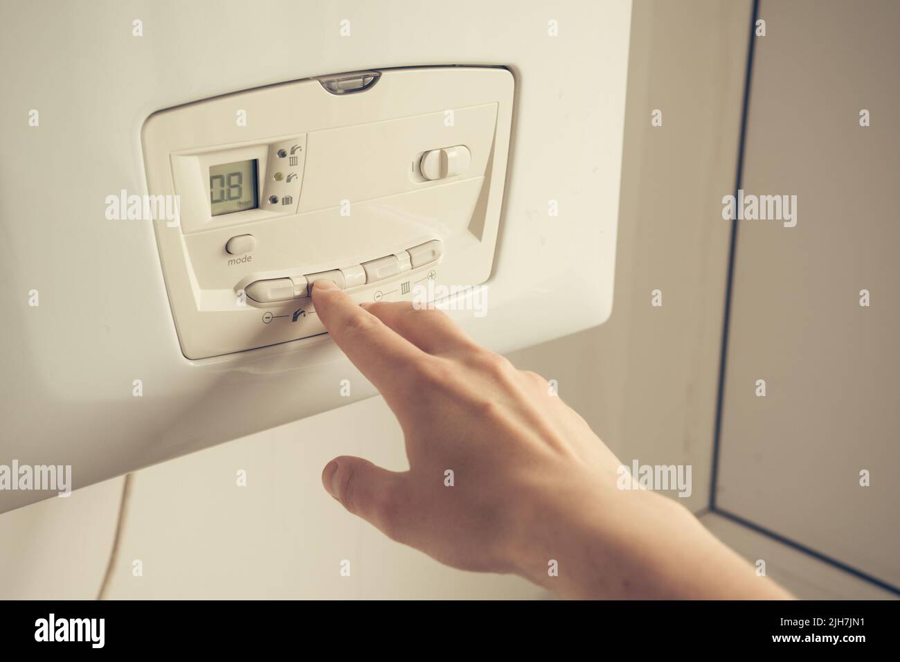 Hand setting temperature hi-res stock photography and images - Alamy