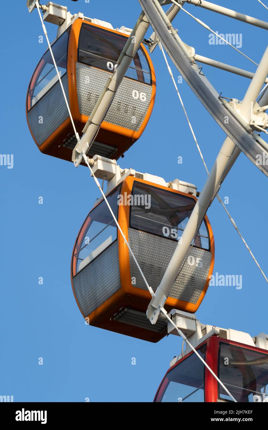 Closeup of colorful cabins of giant ferris wheel in amusement park ...