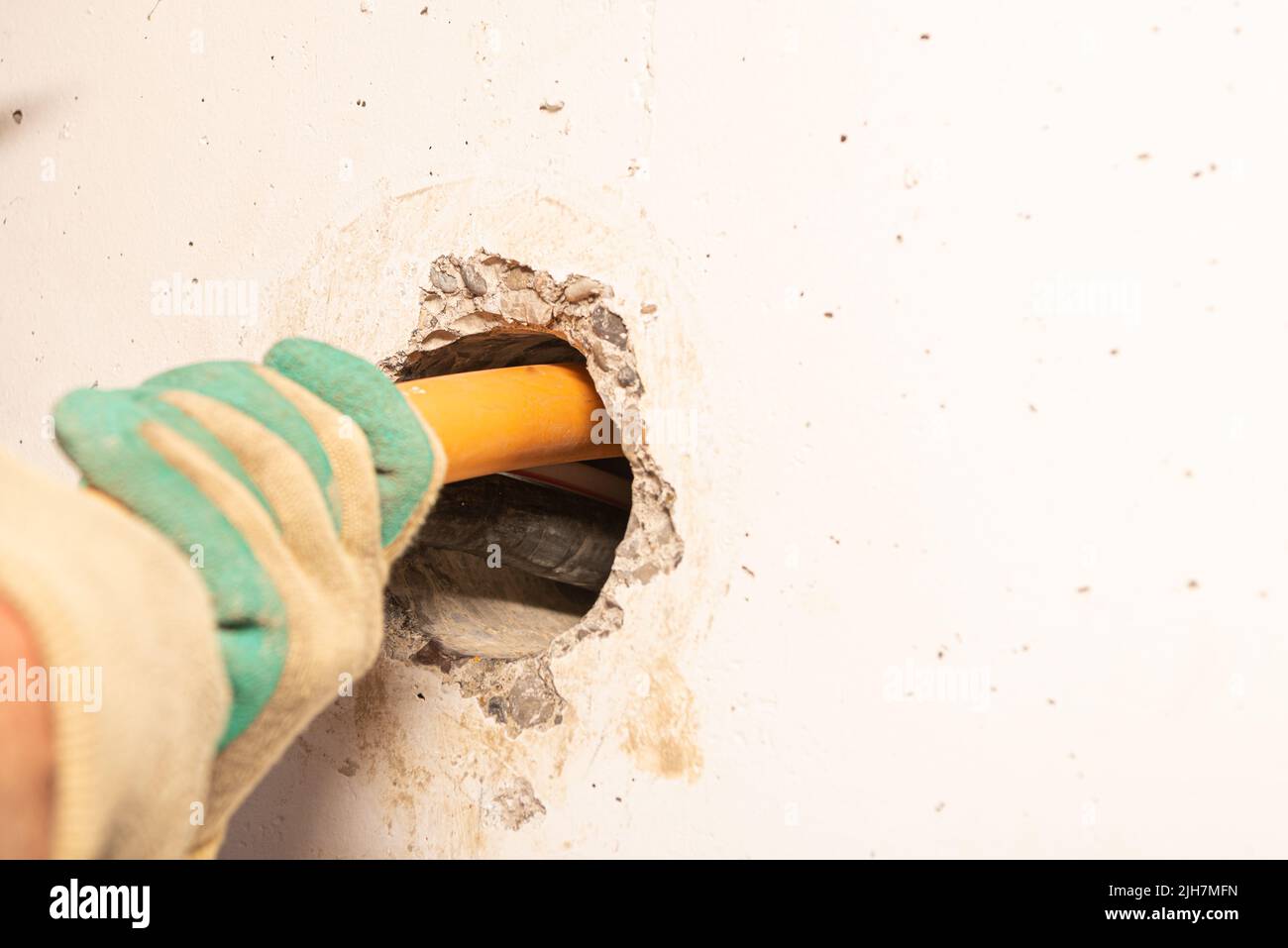 Close up of a wall breakthrough through a core hole by professionals ...