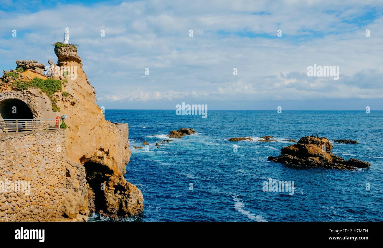 a view of the Rocher de la Vierge in Biarritz, France, a rock formation ...