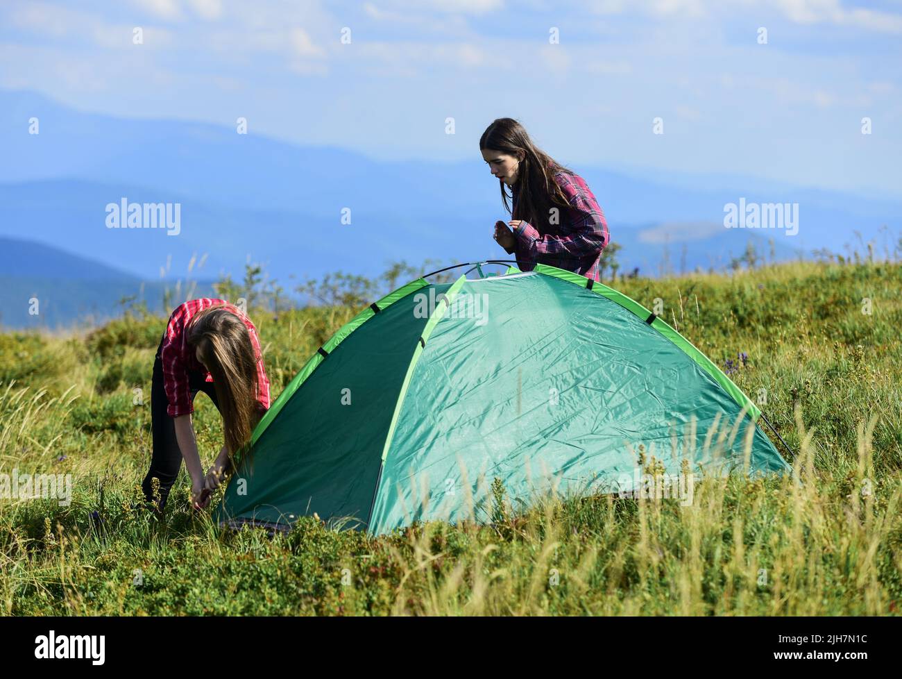 Teamwork concept. Hiking activity. Helpful to have partner for raising ...