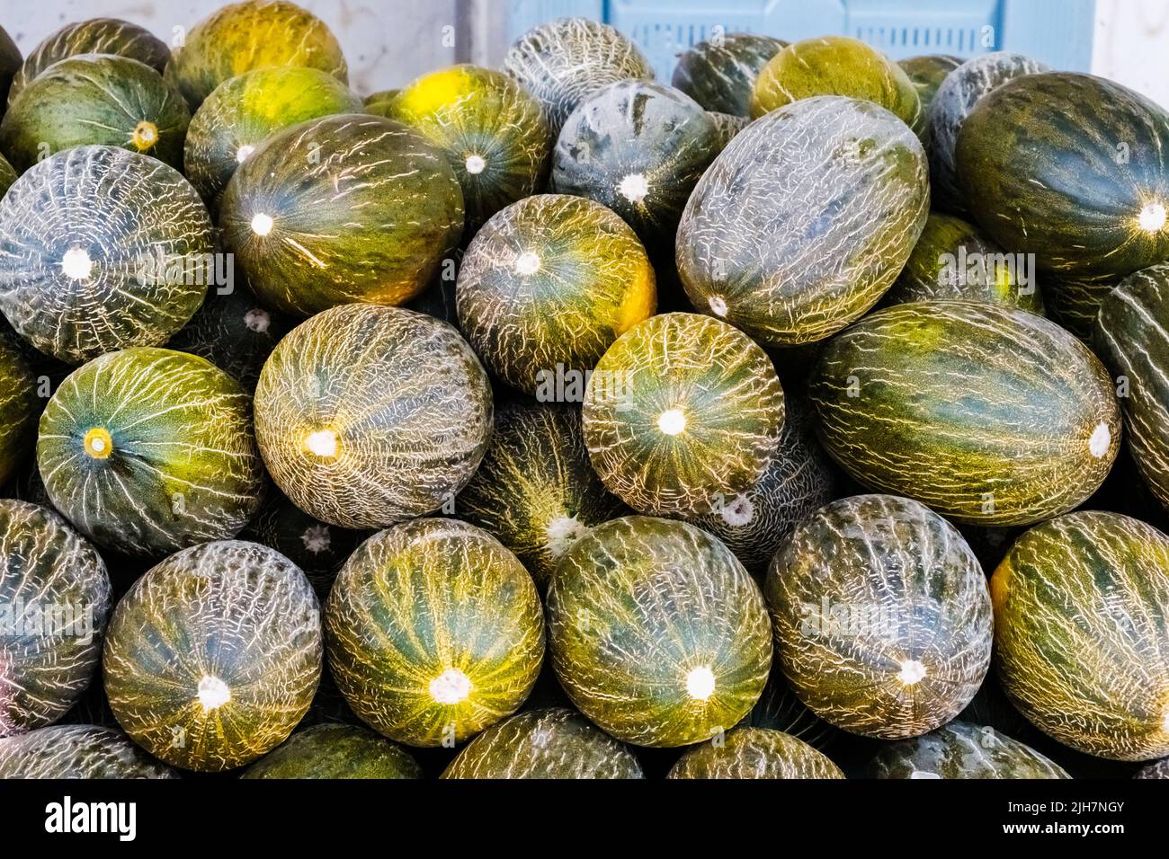 Piled Piel de Sapo melons for sale at a street fruit market Stock Photo ...