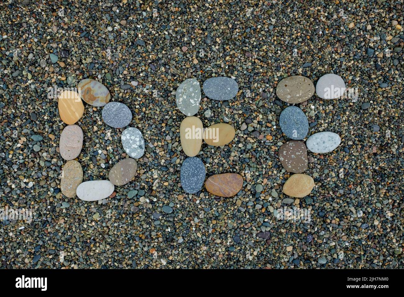 Alphabet letter DEF from stones on sandy beach Stock Photo - Alamy