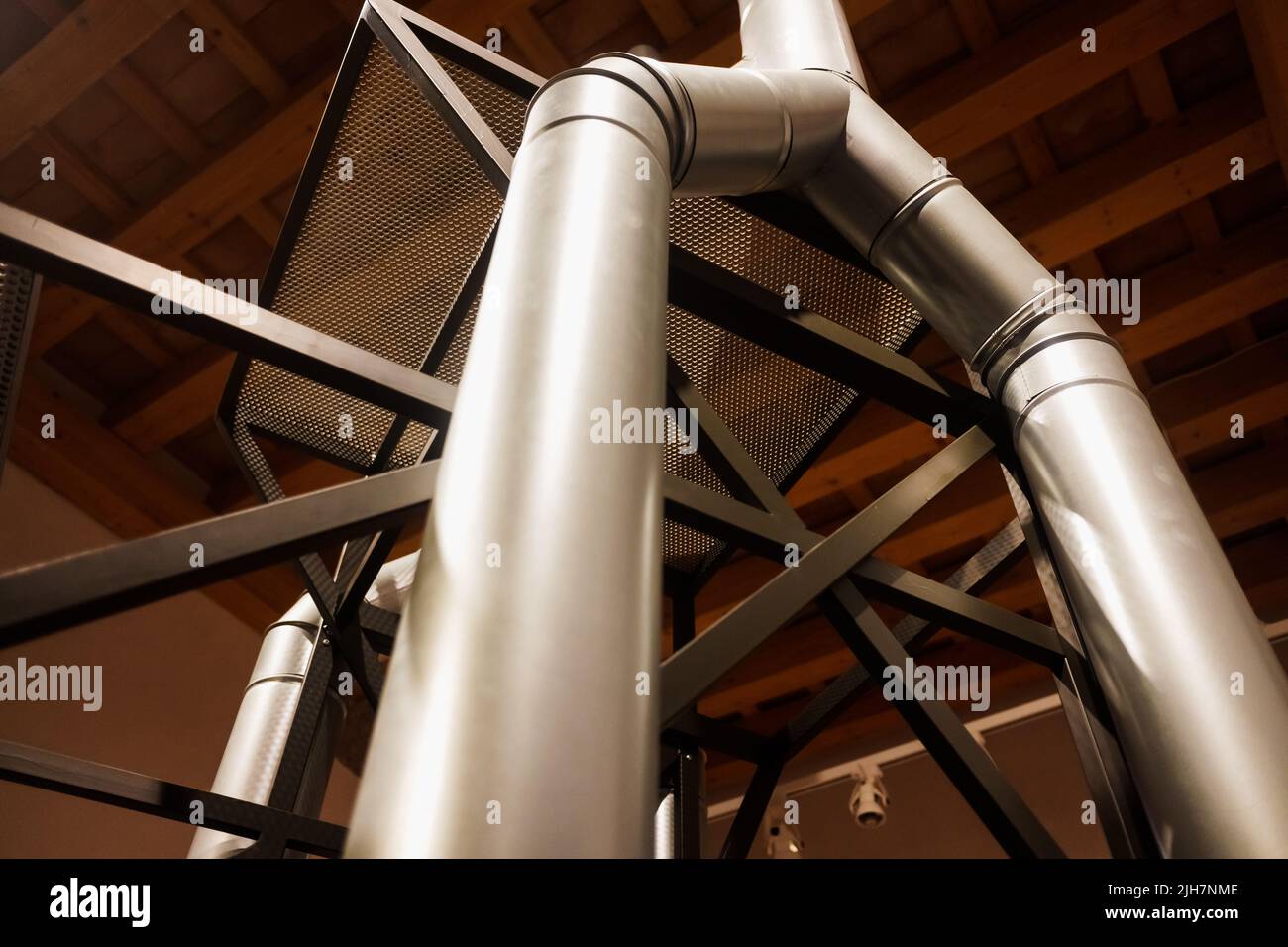 Vertical metal pipes inside an industrial warehouse Stock Photo - Alamy