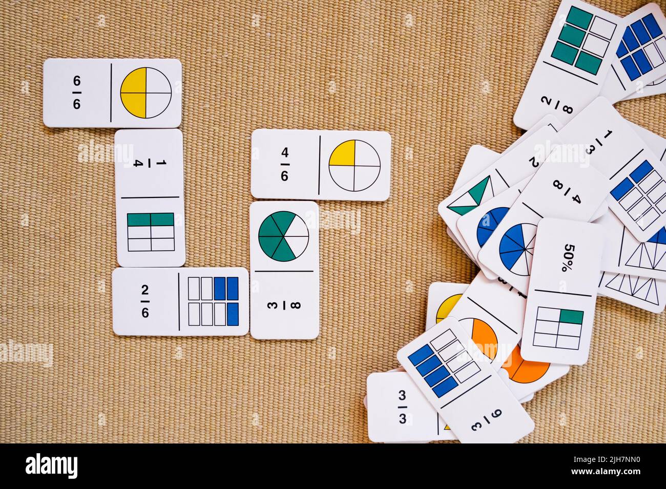 In montessori, fractions are taught with games and colored cards Stock ...